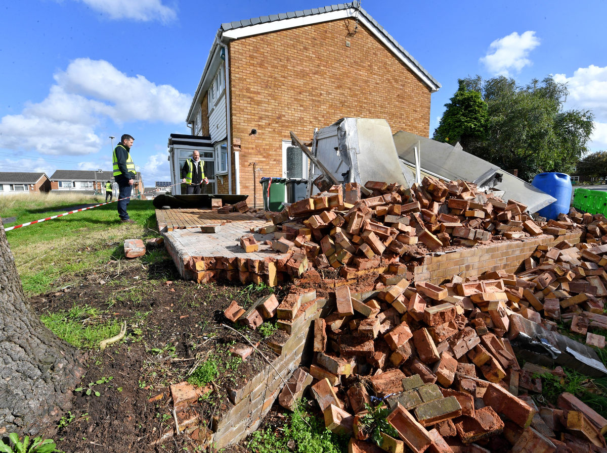 Woman suffers 'serious head injuries' and two arrested after car hits ...