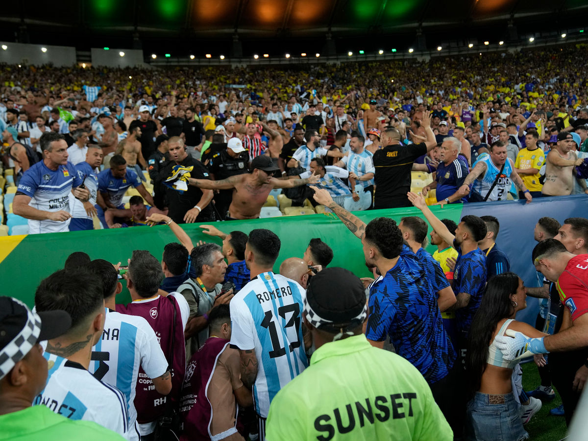 Aston Villa keeper Emi Martinez tries to stop riot police ahead of ...