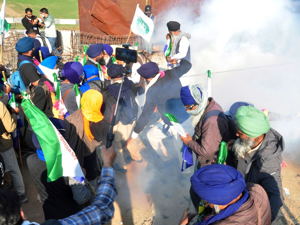 Police in India clash with farmers during protest march over crop ...