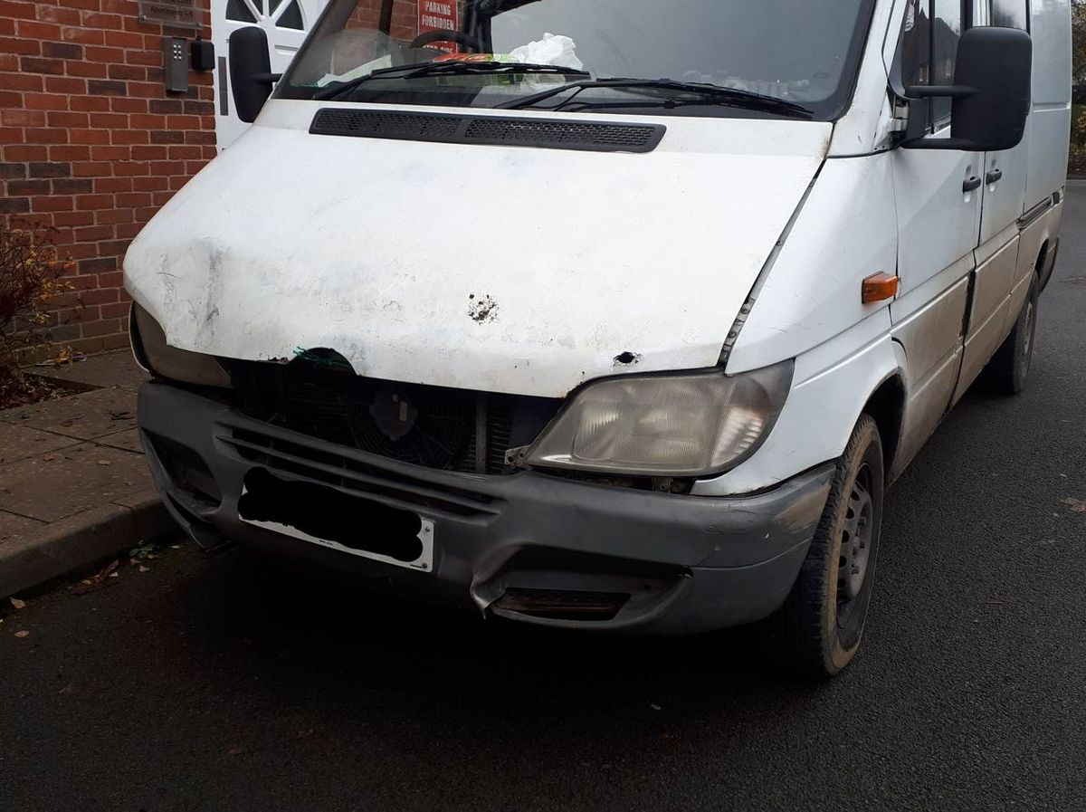 Pictured: Battered van with bonnet 'held by string' that landed driver ...
