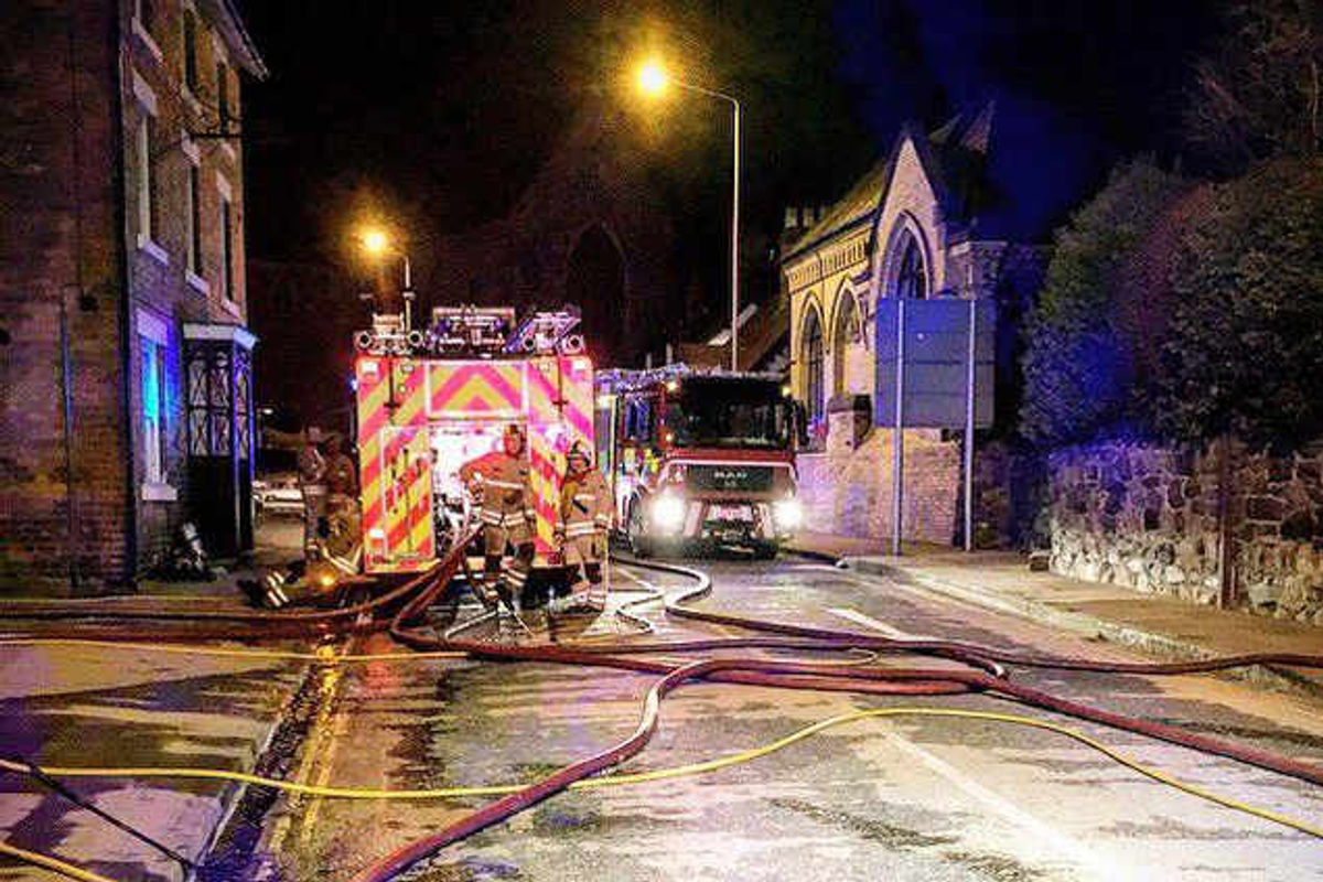Cars and garages go up in flames as 25 firefighters battle Welshpool ...