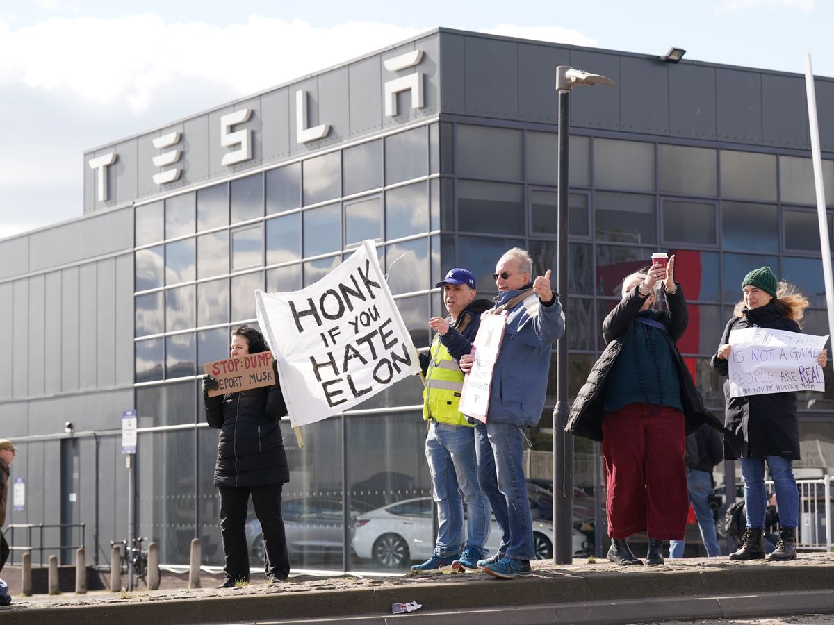 Protesters gathered outside Tesla dealership call for boycott | Express ...