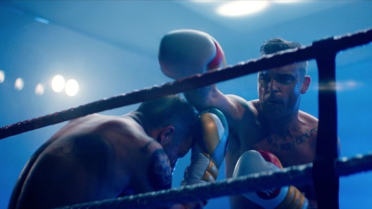Robbie Williams fights himself in the boxing ring in his new video for ...