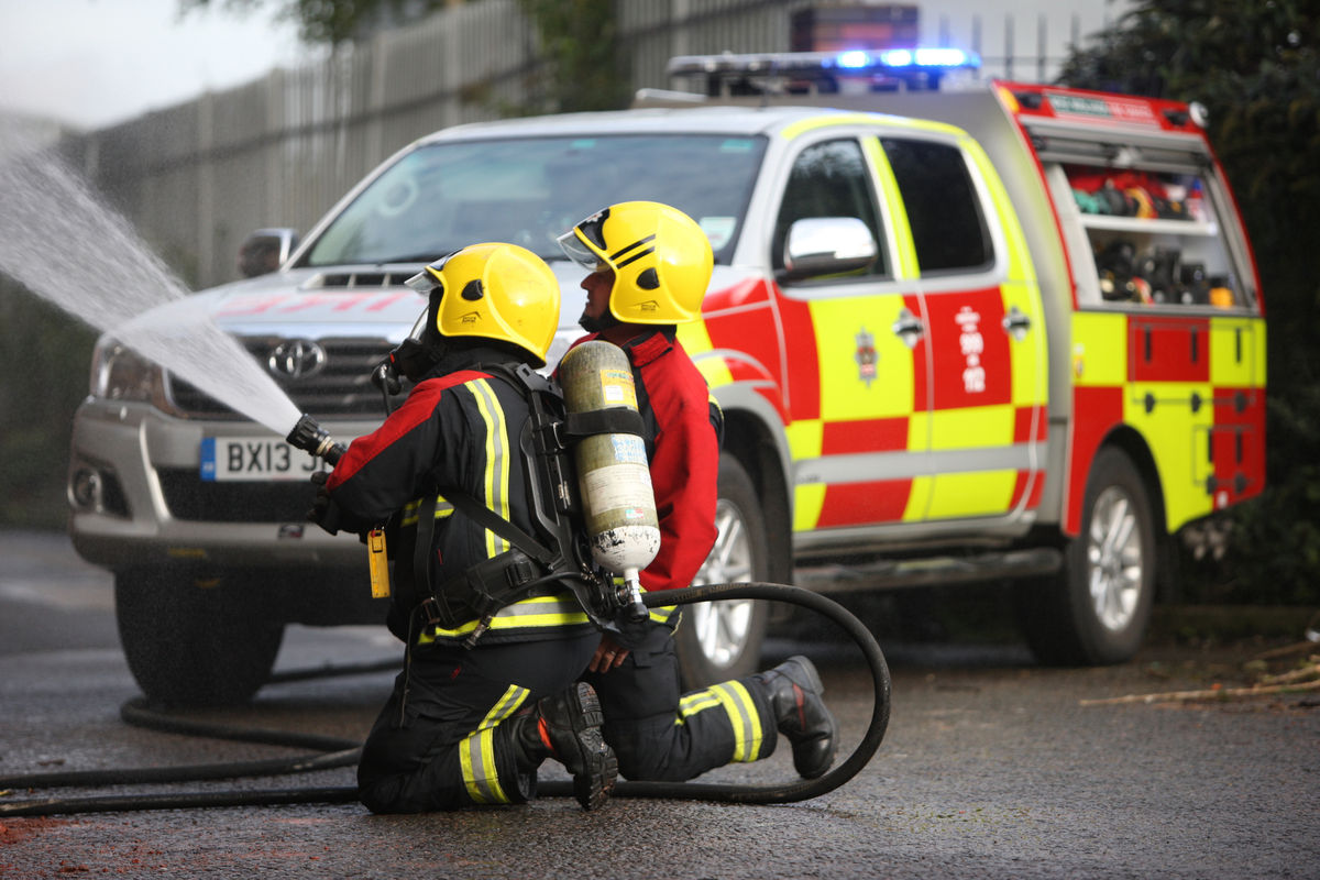 Three fire crews tackle blaze involving office unit, electric vehicle ...