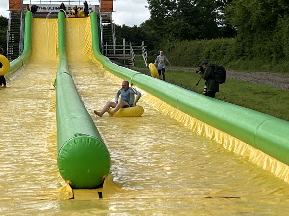 Sir Ed Davey defends election stunts as he races down water slide in ...