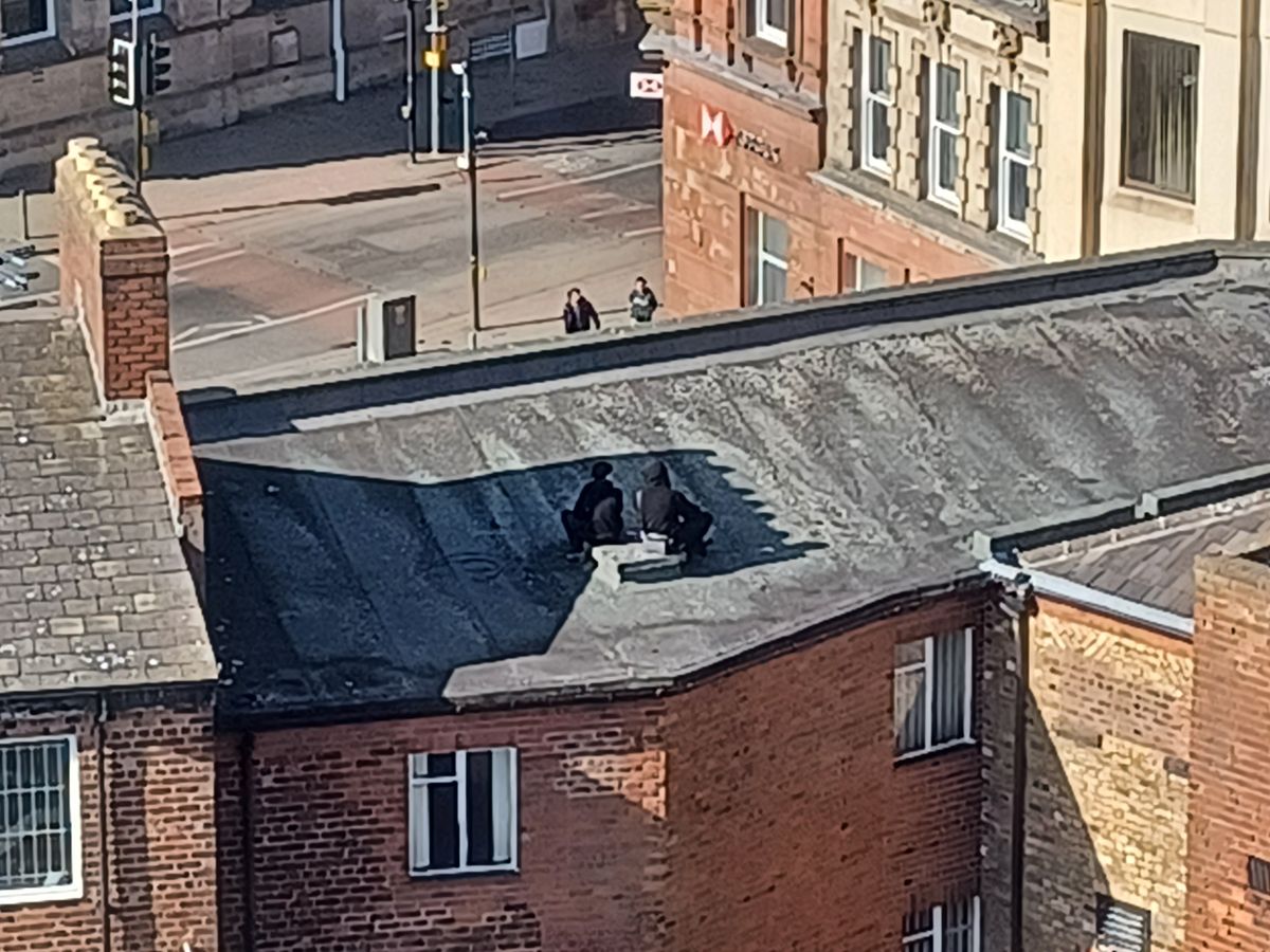 Wolverhampton office workers look on in shock as hooded pair run across ...
