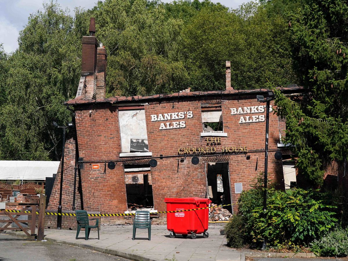 Man and woman arrested in connection with suspected Crooked House arson ...
