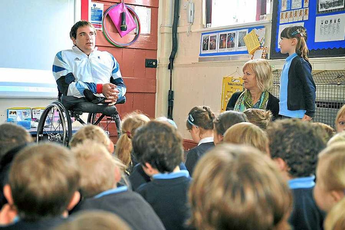 Paralympics medal winner Mickey Bushell is welcomed by Newport pupils ...