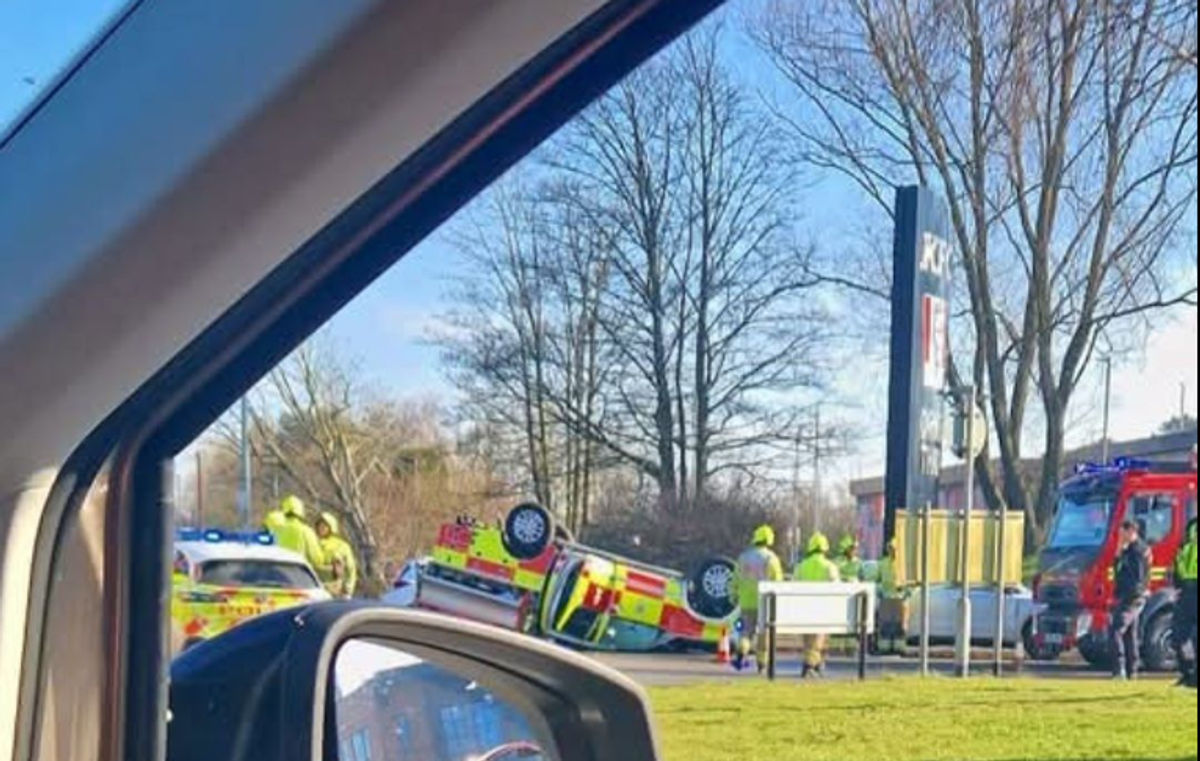 Fire truck overturns after crash with car on busy roundabout in ...
