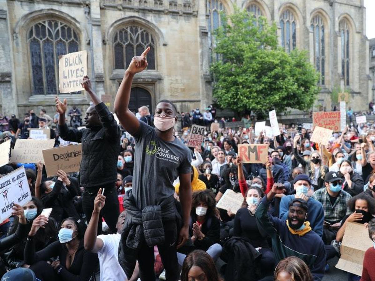 Protesters block street in protest over Cecil Rhodes statue ...