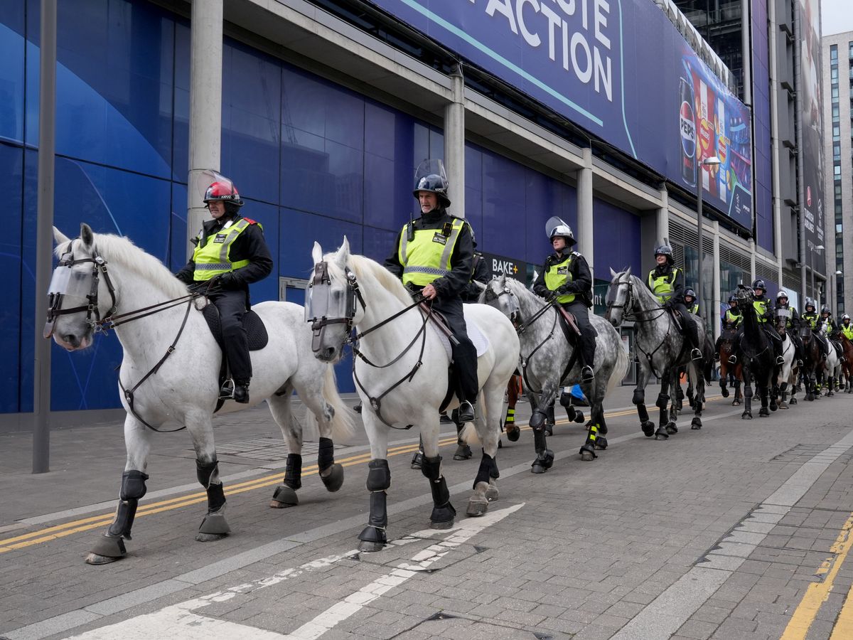 Three people charged with invading pitch during Champions League final ...