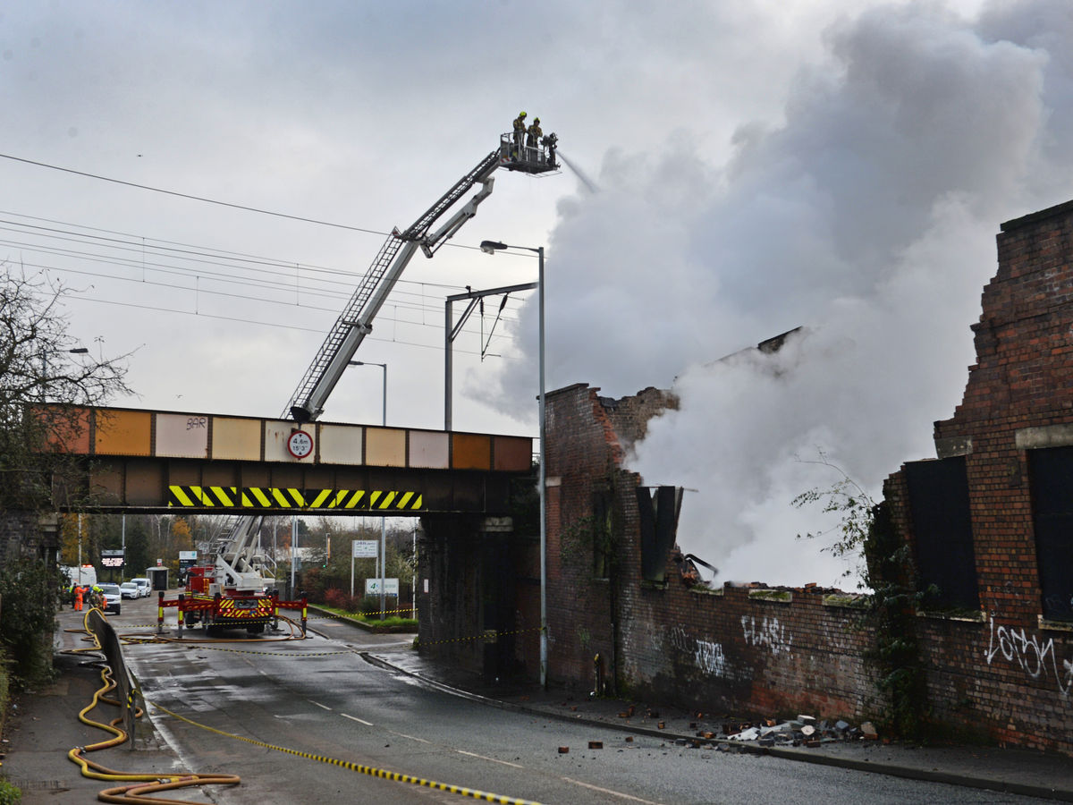 Roads closed and trains cancelled as fire crews continue to tackle ...