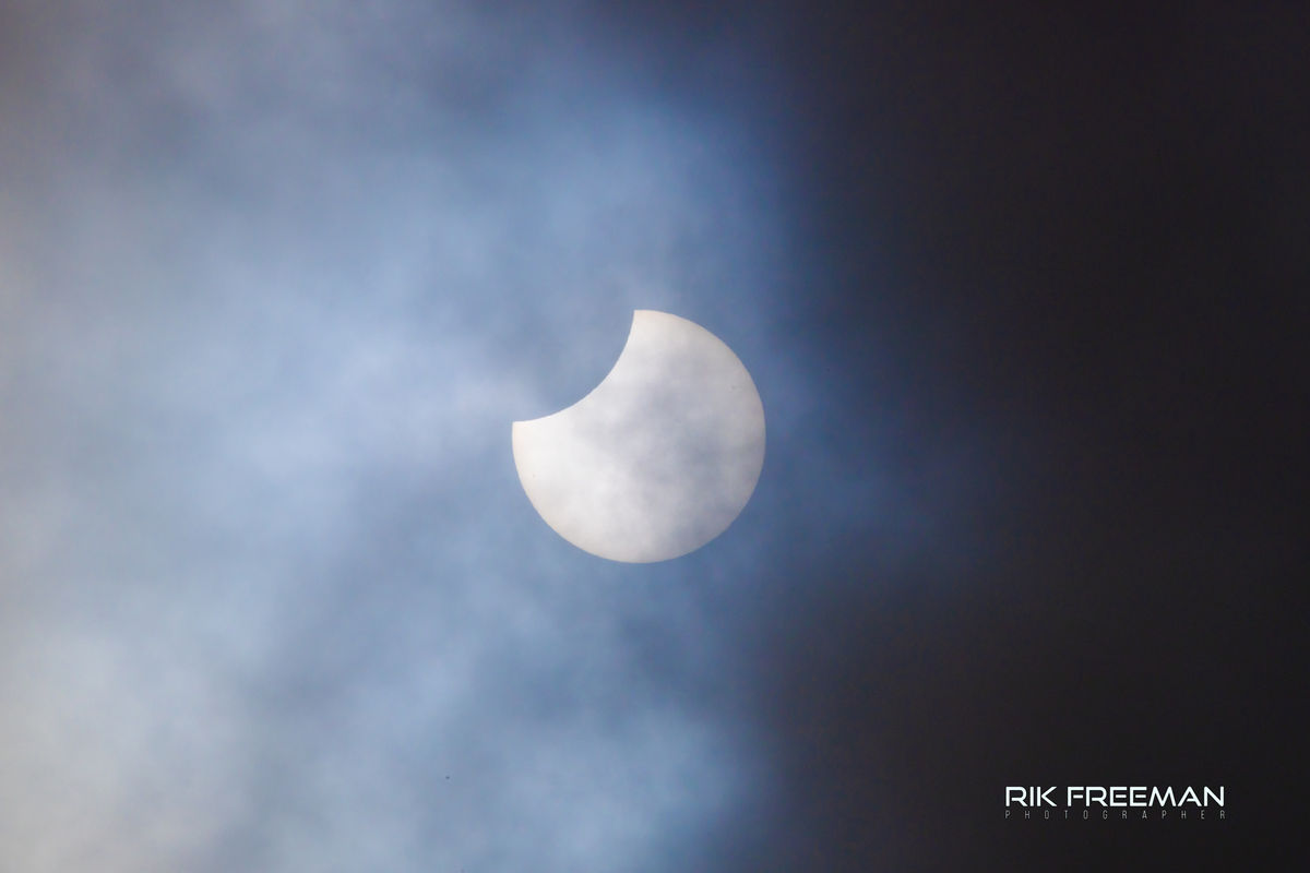 Lucky residents defy clouds to capture stunning partial solar eclipse ...
