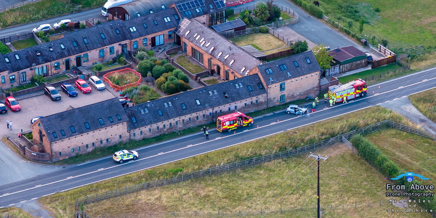 Major stretch of A483 closed after car hit building on outskirts of ...