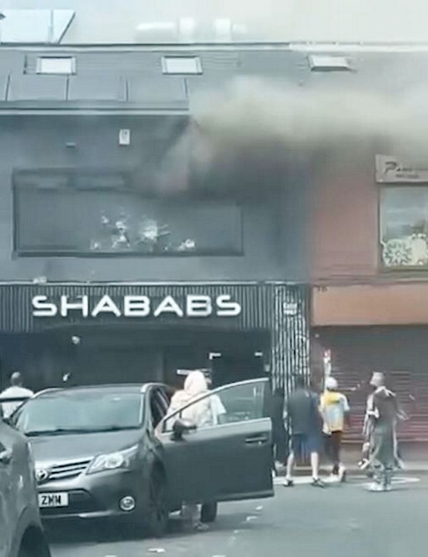 West Midlands: Dramatic moment hero passersby hurl rocks at window of ...