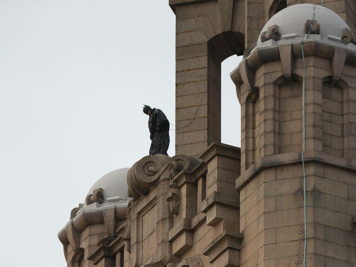 Batman stunt double spotted on top of Liverpool’s Royal Liver Building ...