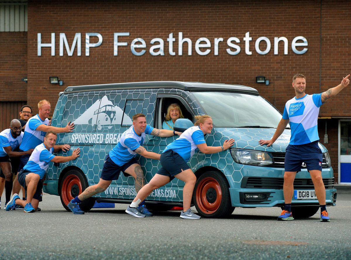 Six prison staff from HMP Featherstone in Wolverhampton push camper-van ...