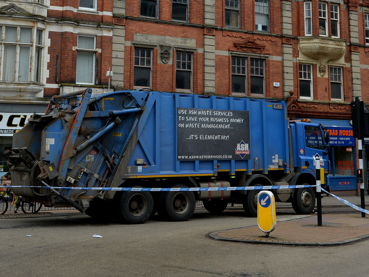 Woman seriously injured after being trapped under bin lorry in ...