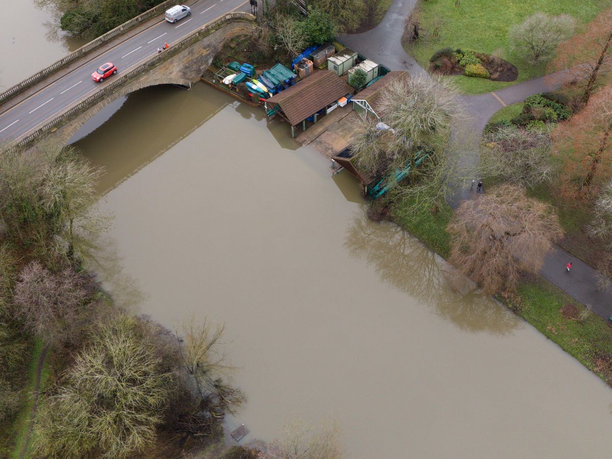 Ice warning after heavy rain and melting snow causes flood disruption ...